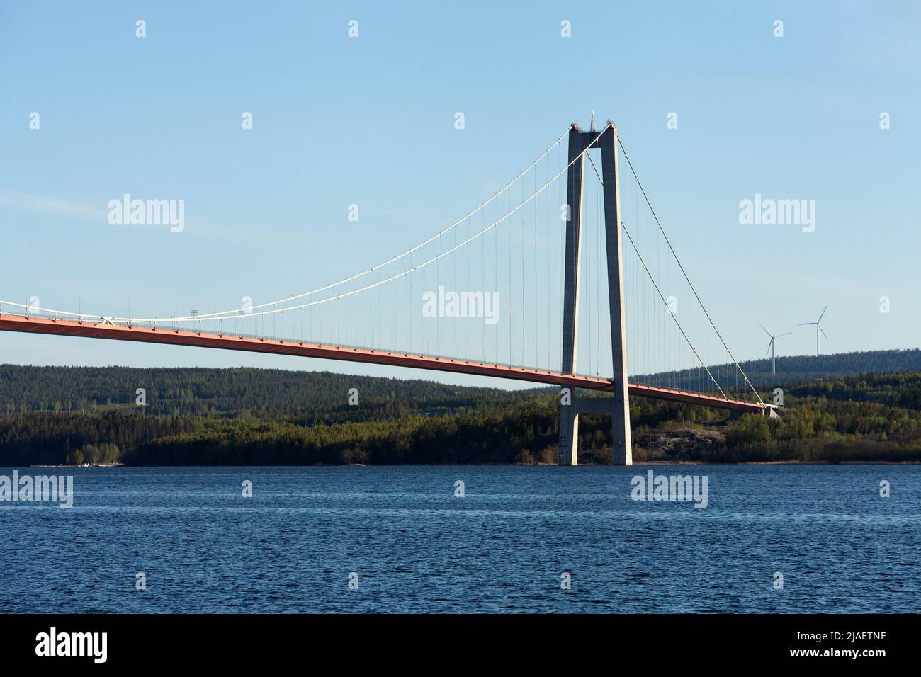 View of the High Coast Bridge, brackets, and buildings. Pylons, river ...