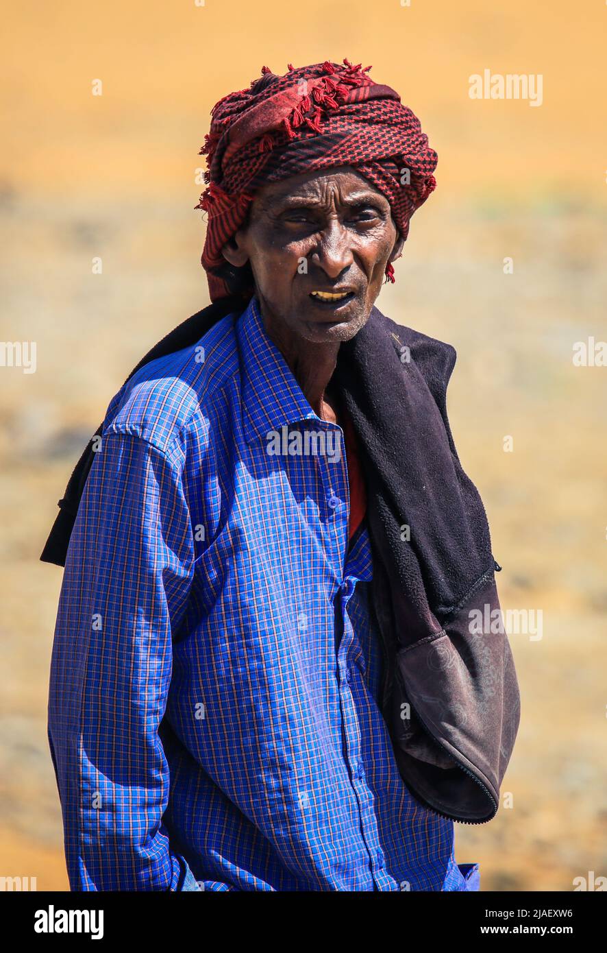 Old Man in traditional Clothes on the street Stock Photo - Alamy