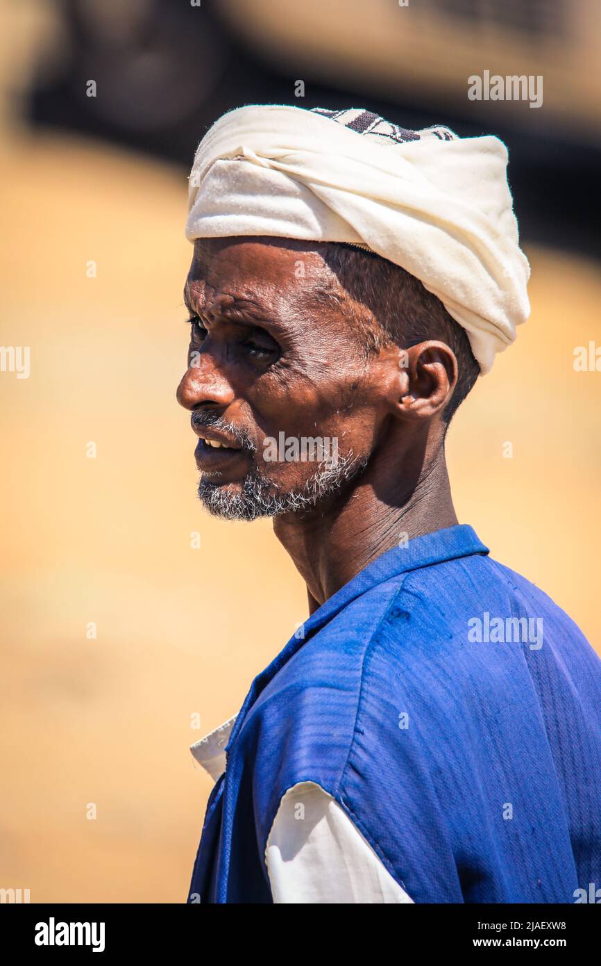Old Man in traditional Clothes on the street Stock Photo - Alamy