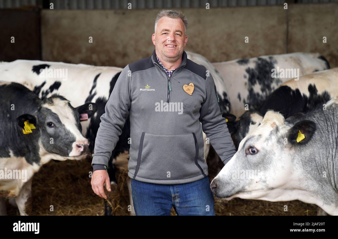 EDITORIAL USE ONLY Farmer, Paul Coates tends to his livestock at his ...