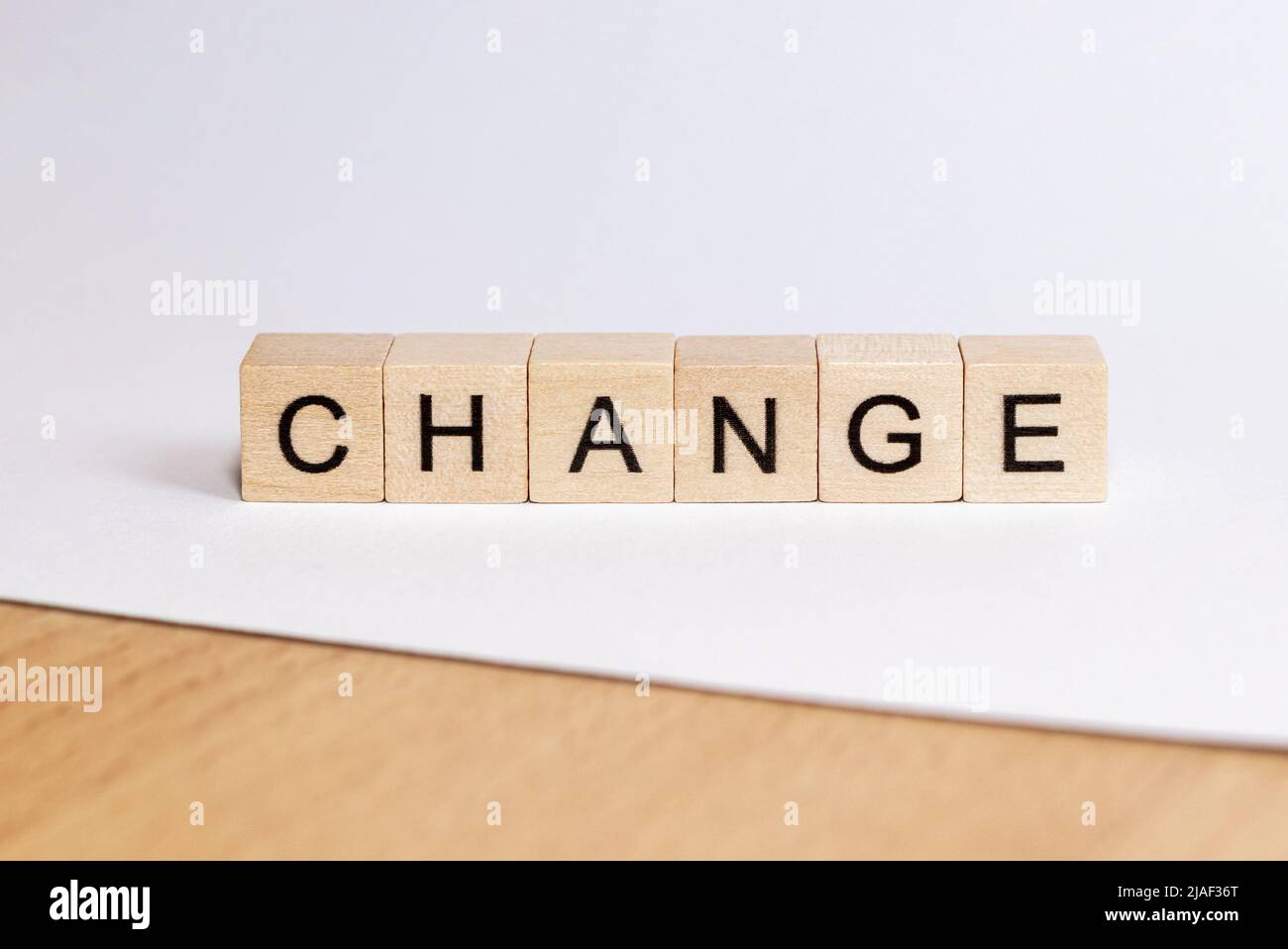 Wooden cubes with the word Change on a white background Stock Photo - Alamy