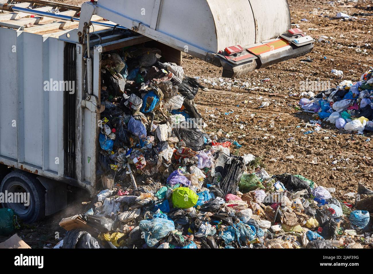 Truck unloading garbage on an open air dump. Waste recycling Stock ...