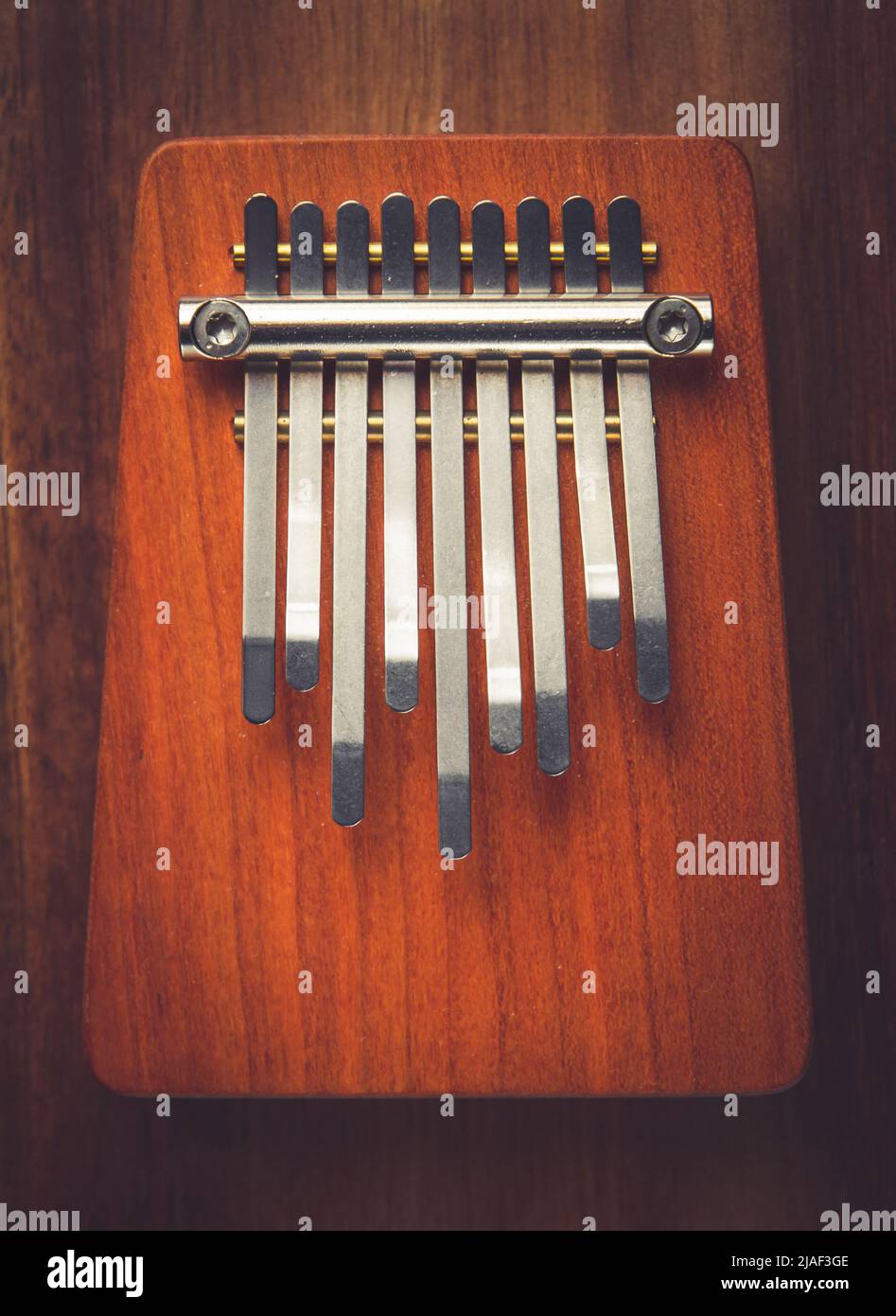 Traditional wooden kalimba on a wooden board background Stock Photo - Alamy