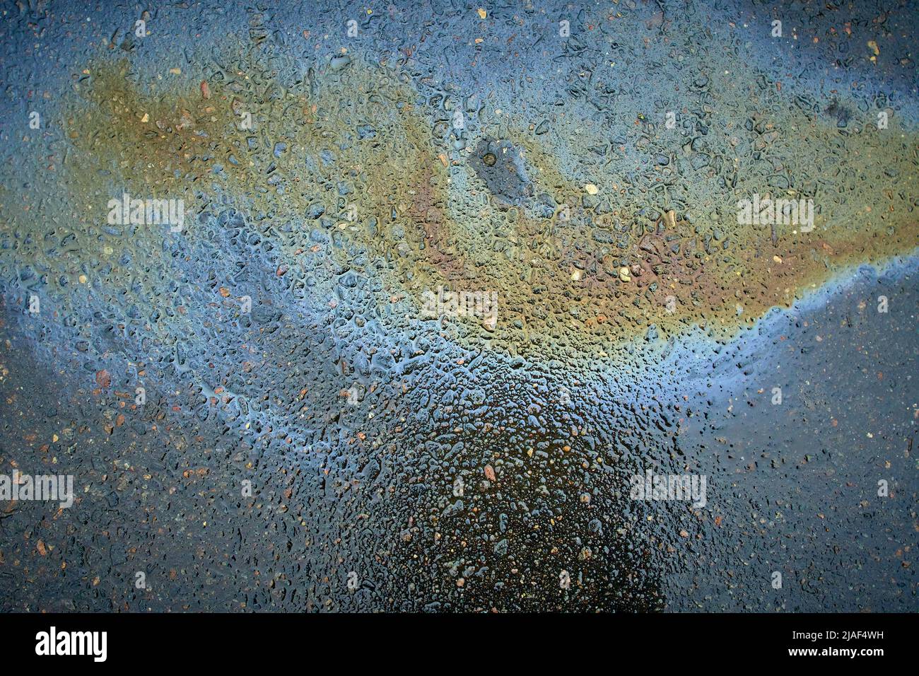 Oil stain on Asphalt, color Gasoline fuel spots on Asphalt Road as ...