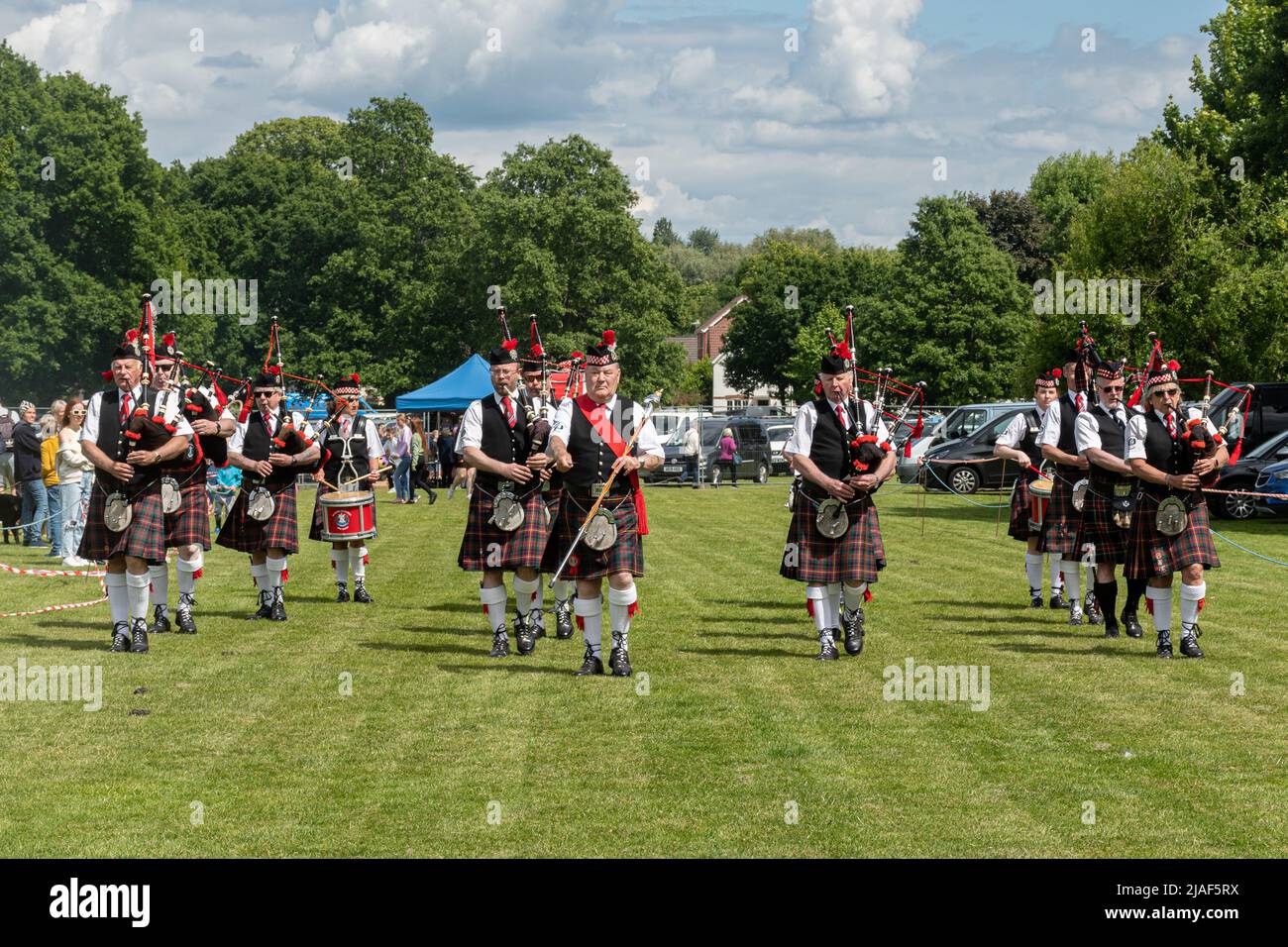 Reading Scottish Pipe Band marching into the arena entertaining people ...