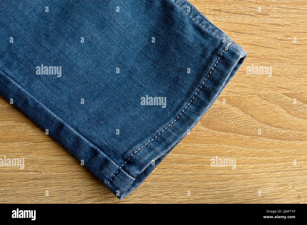 Seam blue denim cotton jeans leg detail, fabric texture background and ...