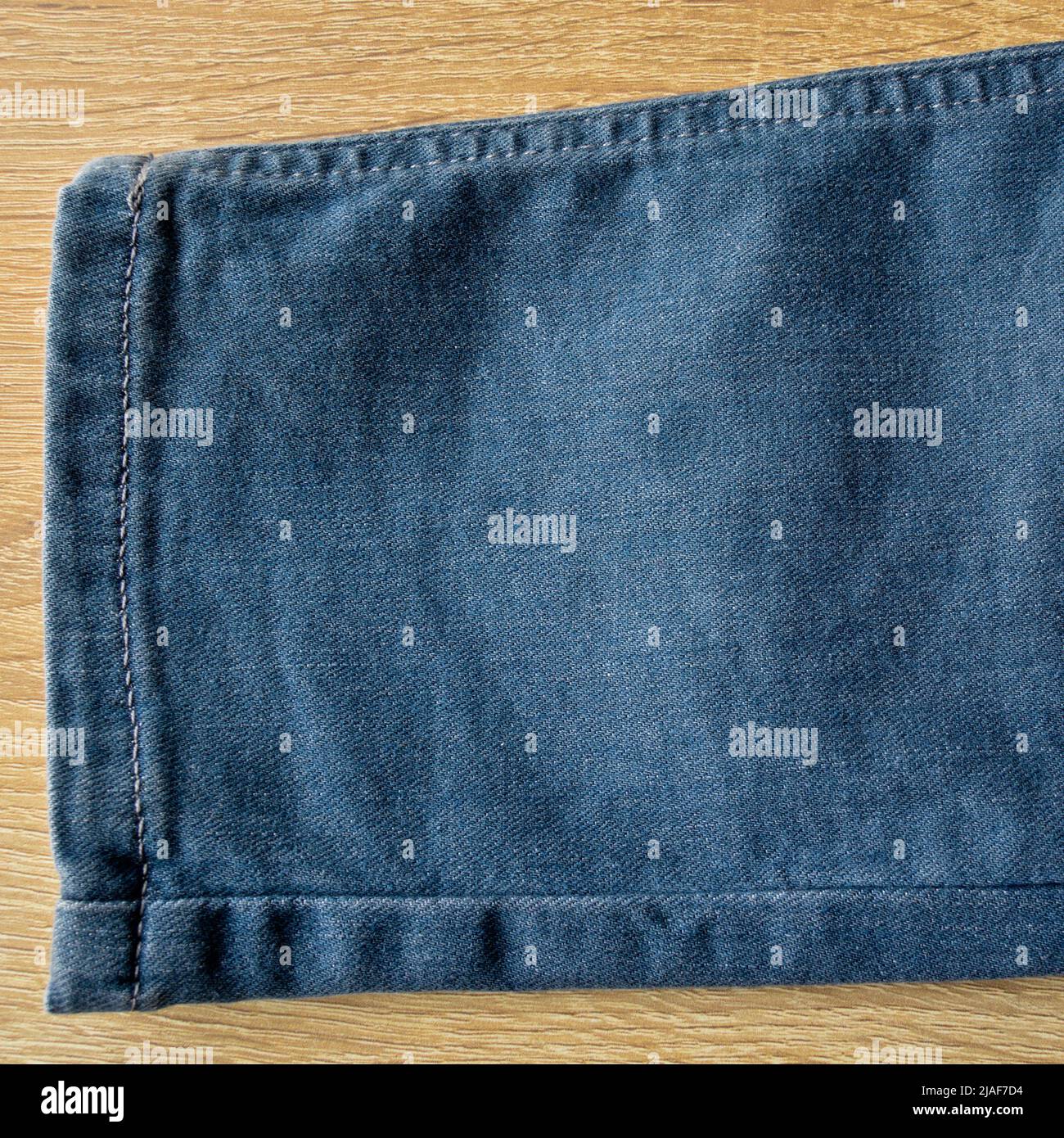 Seam blue denim cotton jeans leg detail, fabric texture background and ...