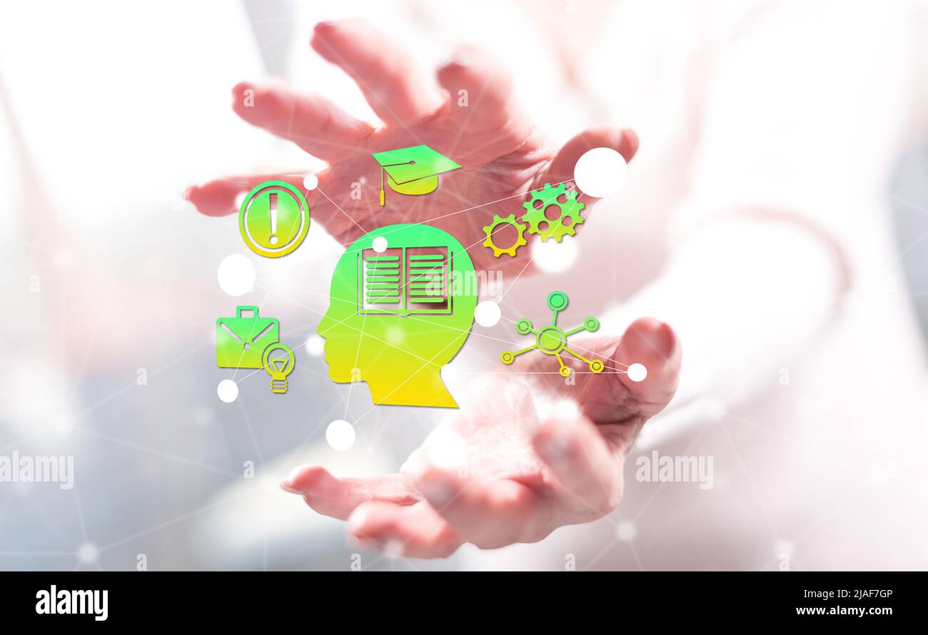 Knowledge concept between hands of a woman in background Stock Photo ...