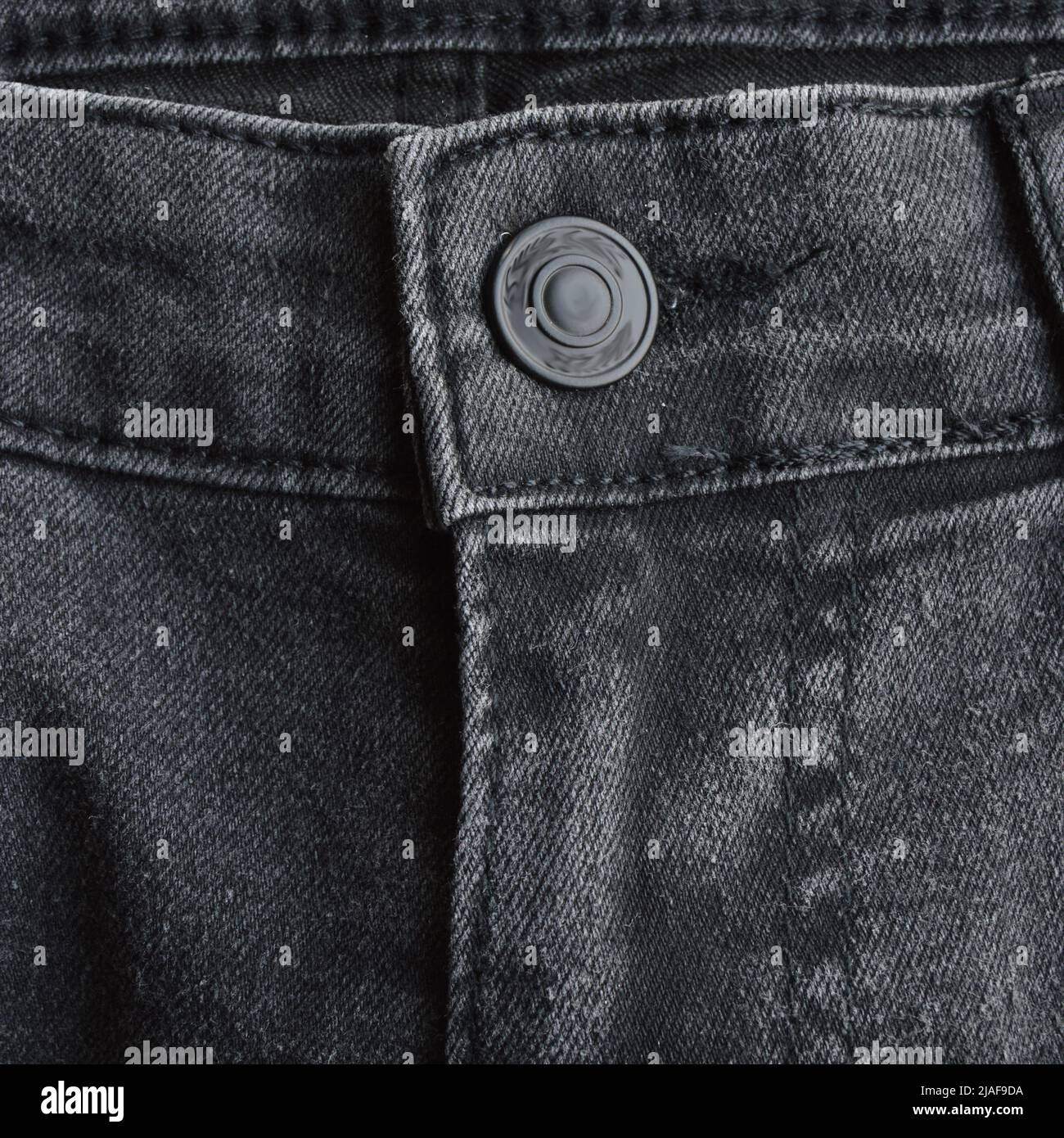 Zipper pocket and buttons close-up detail of light black jeans denim ...