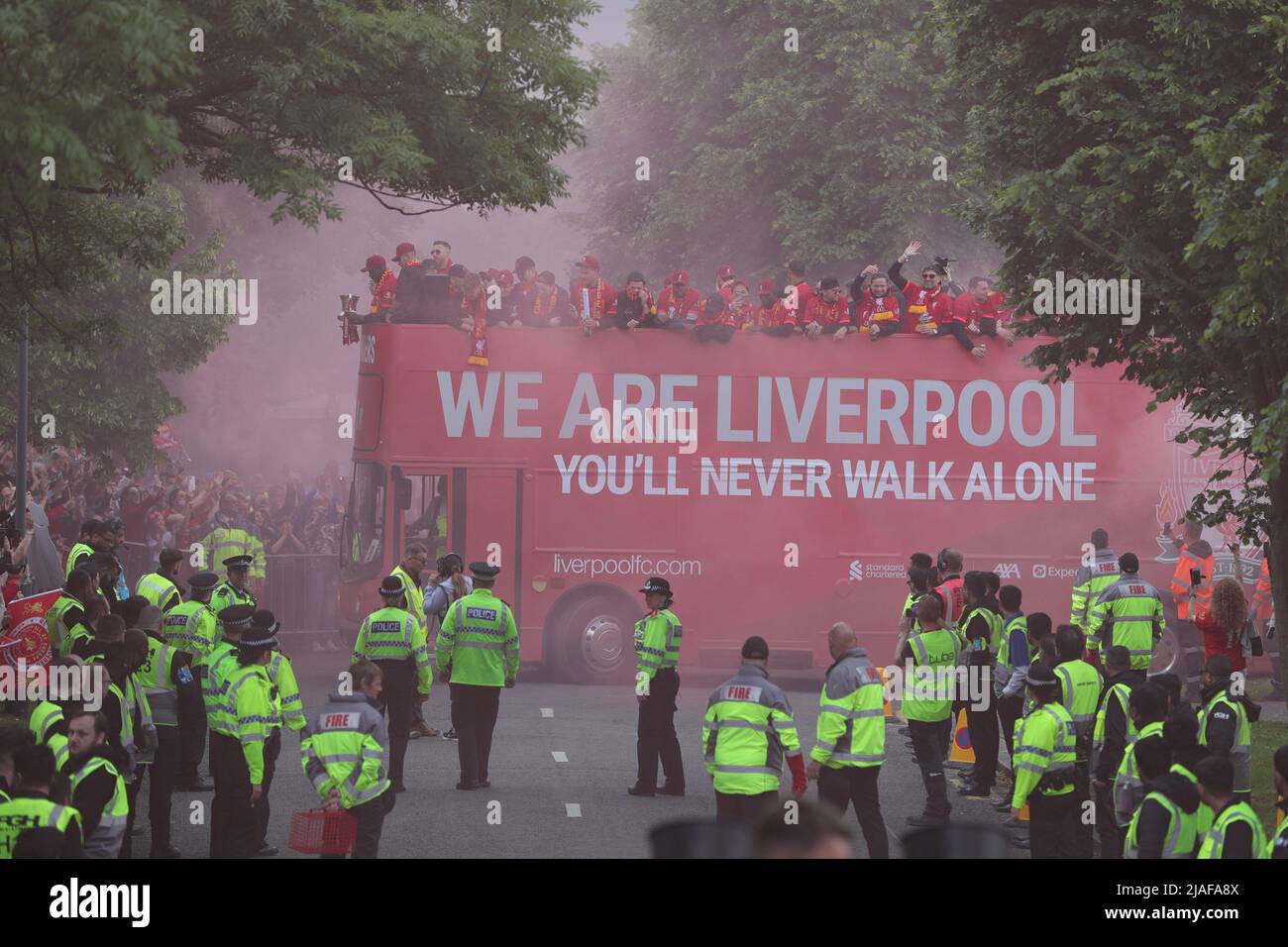 The Liverpool FC squad celebrate during the open top bus parade through ...