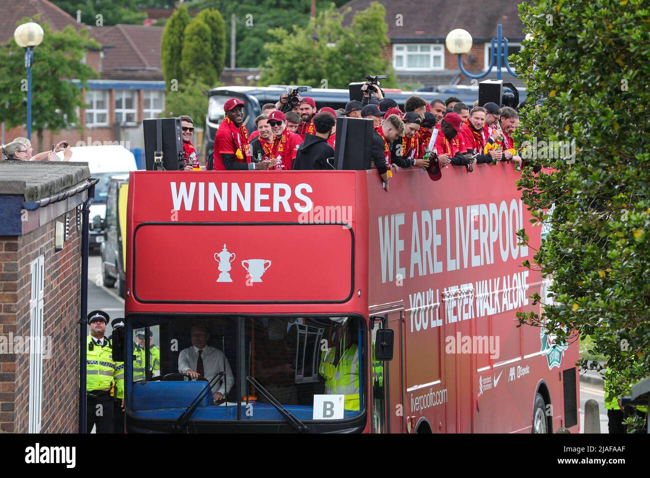 The Liverpool FC squad celebrate during the open top bus parade through ...