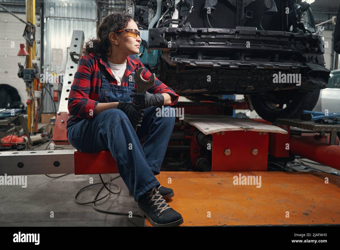Mechanic sitting in automotive hi-res stock photography and images - Alamy
