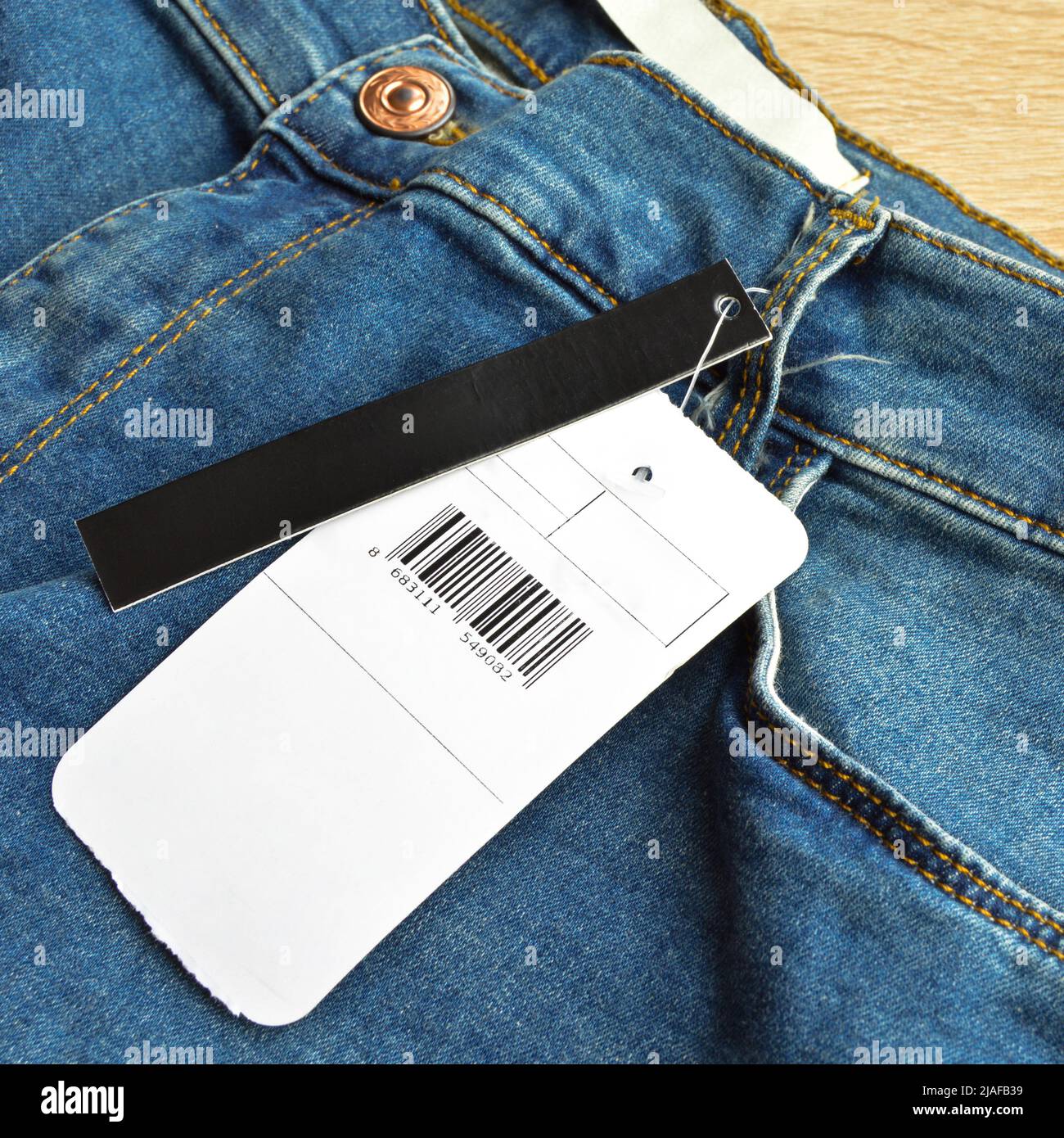 Price tag barcode on jeans hi-res stock photography and images - Alamy