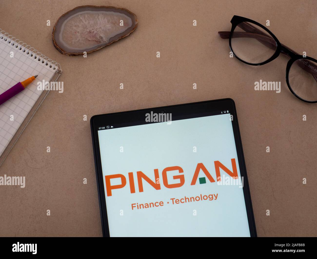 In this photo illustration Ping An Group logo seen displayed on a ...