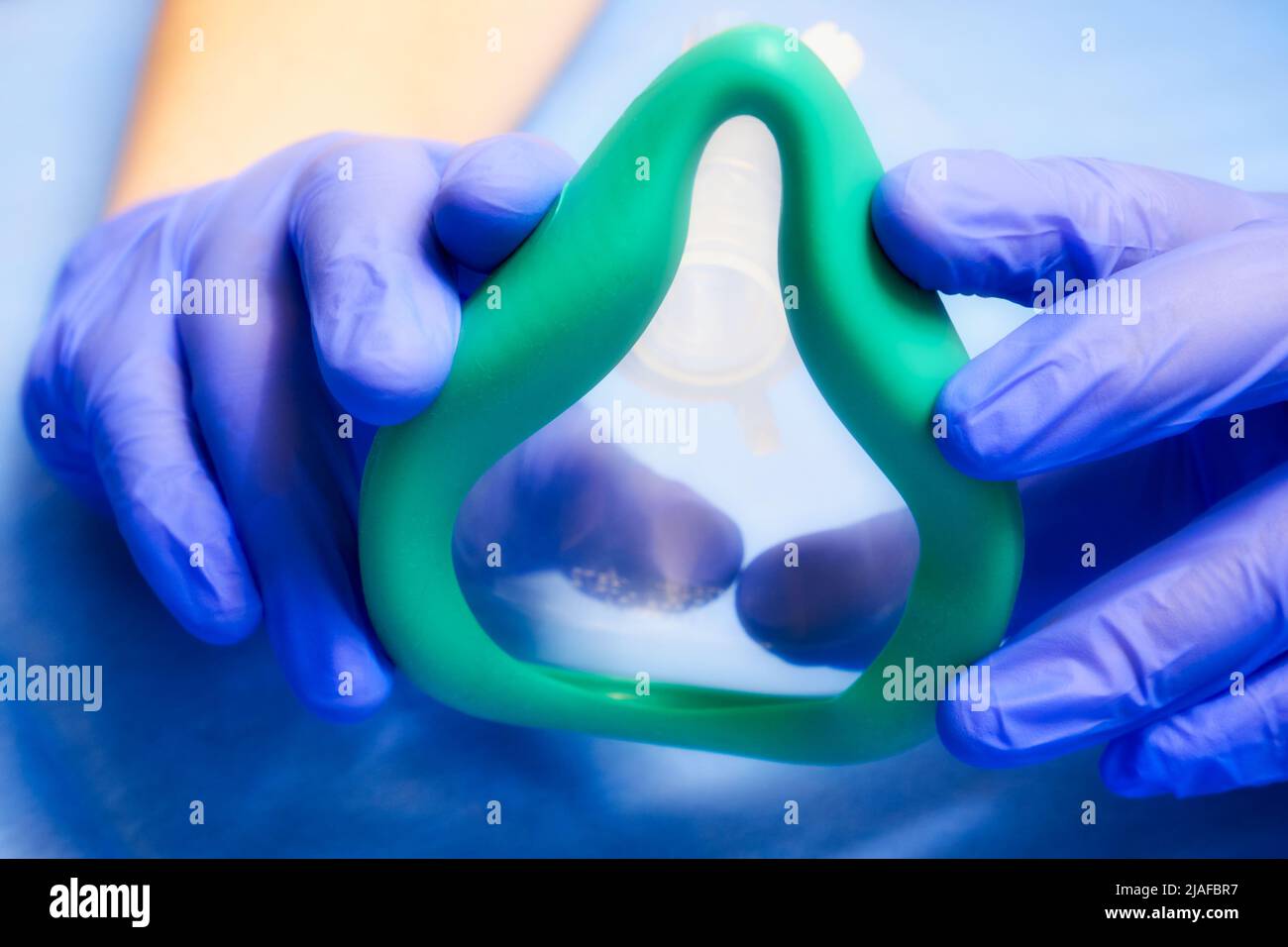 Anesthesia mask. Hands of a medic in gloves and an anesthesia mask ...