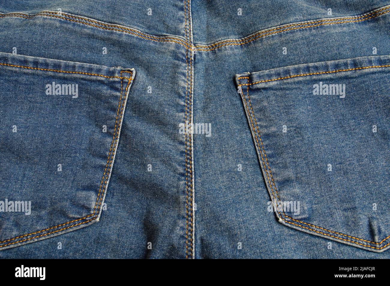Close up detail of back pocket of light blue jeans denim Stock Photo ...