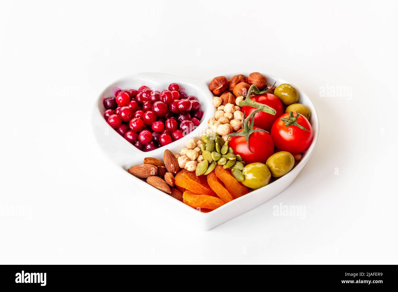 Healthy food in heart shaped dish. Healthy lifestyle and nutrition ...