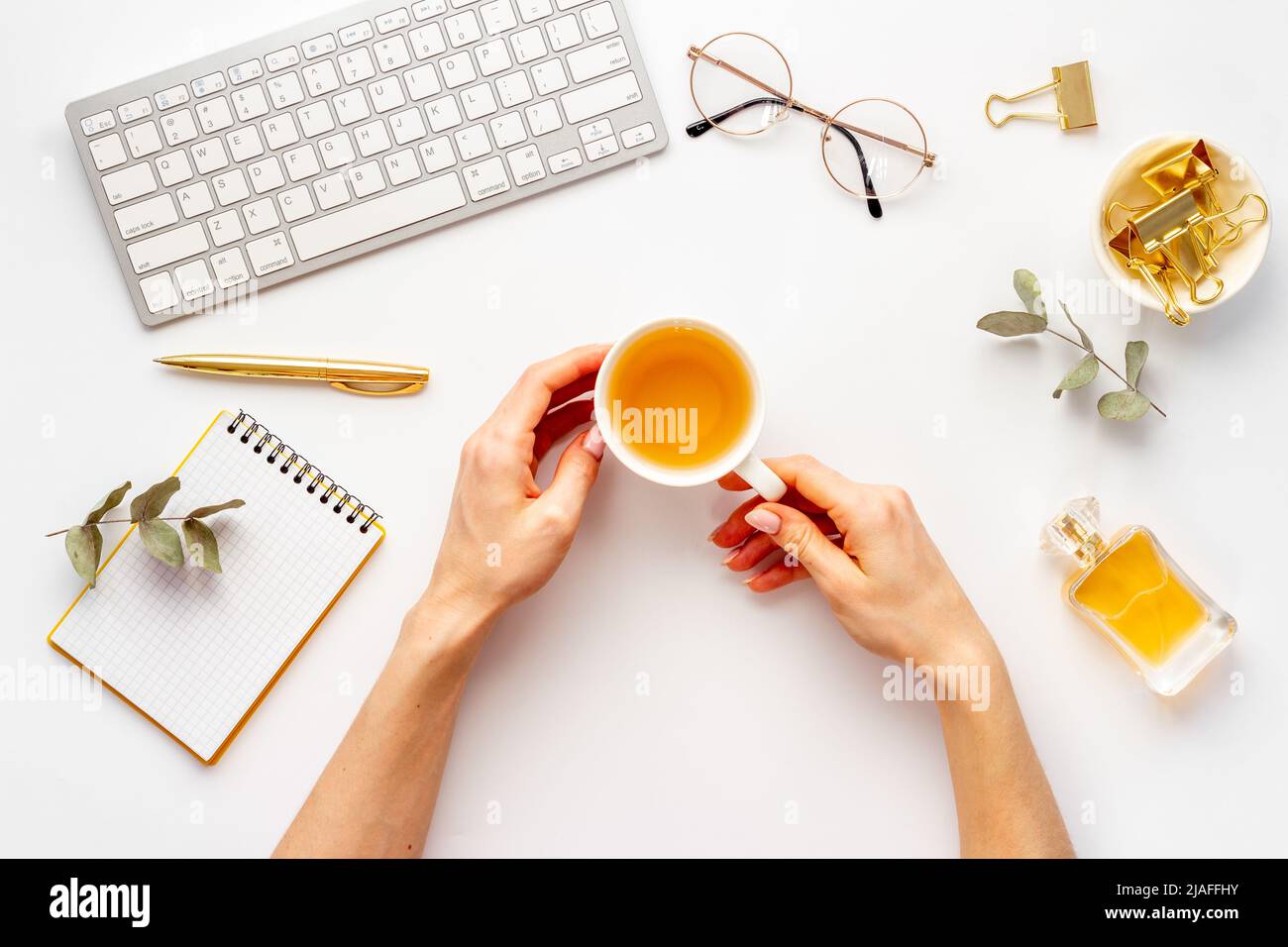 Female hands working on office table. Layout of blogger or designer ...