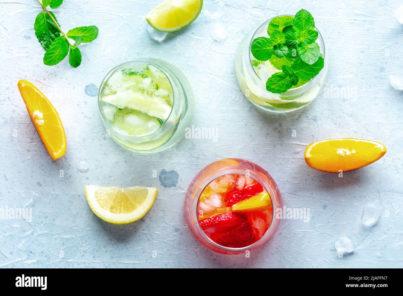 Fresh summer cocktails or mocktails with fruit and ice, a vacation ...