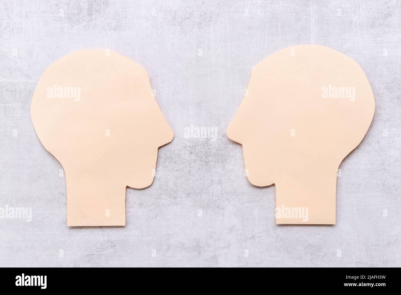 Two shape of men head - connection and communication concept Stock ...