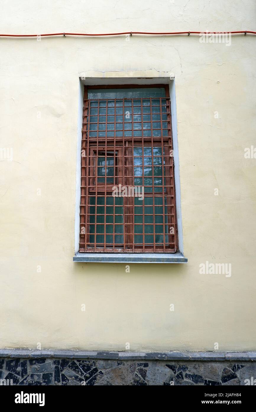 Old wooden window with metal bars Stock Photo - Alamy