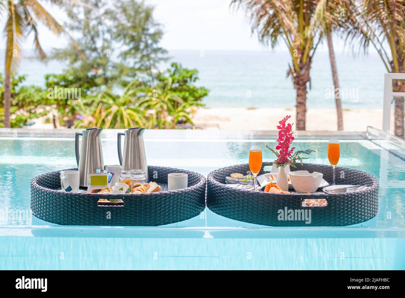 Breakfast in swimming pool, floating breakfast in tropical resort ...