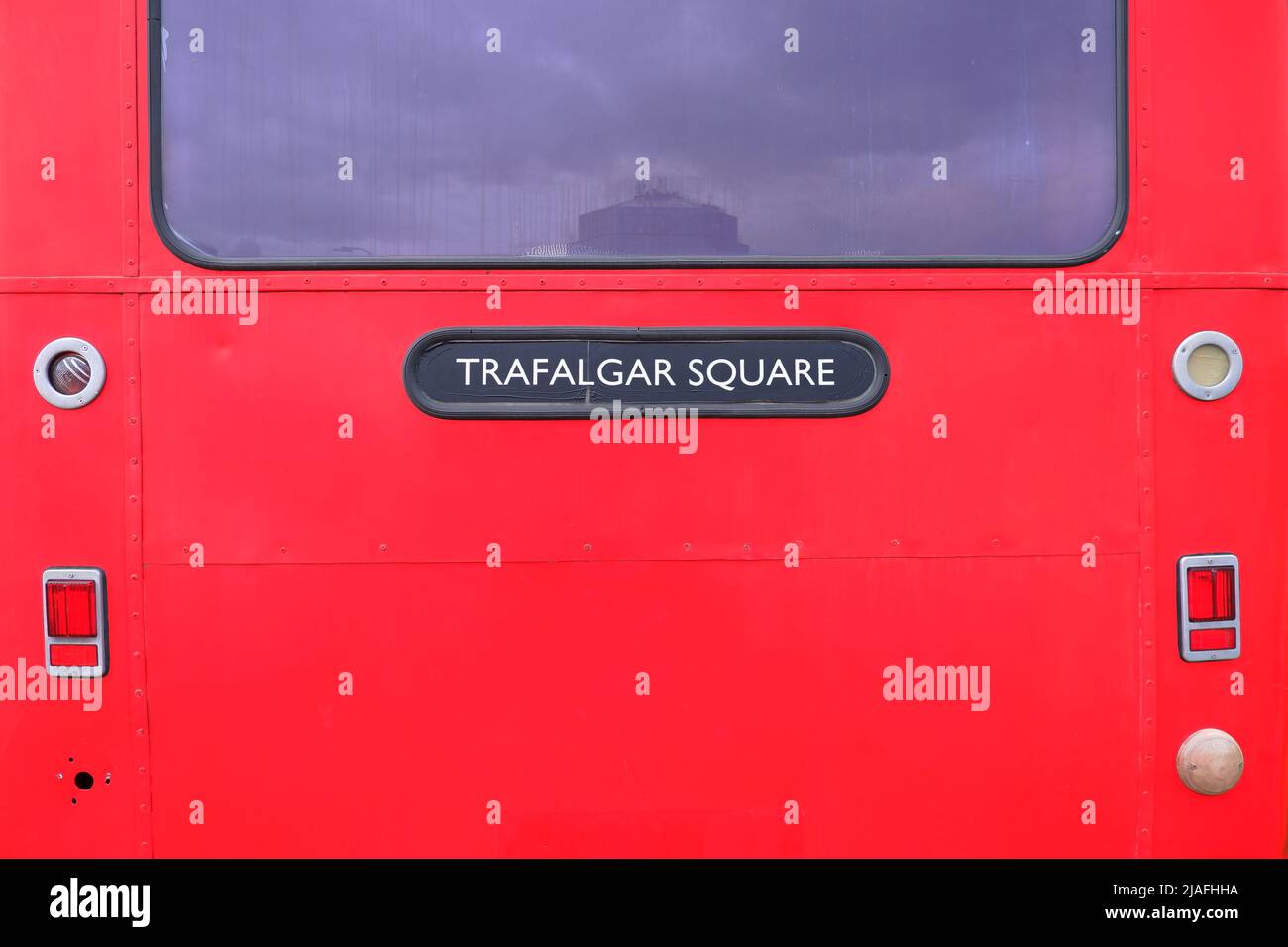 Back of a red London bus with taillights Stock Photo - Alamy