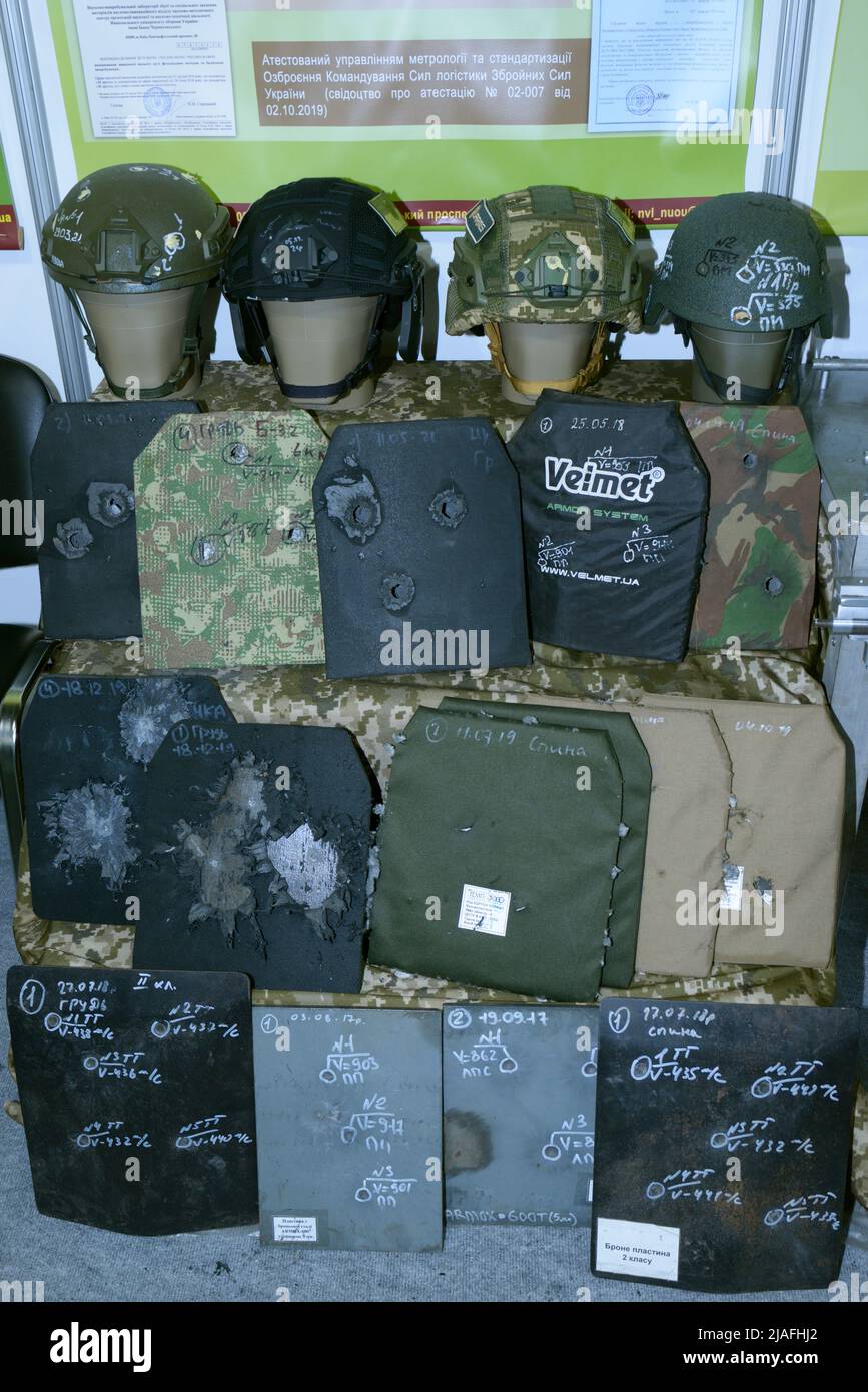 Body armor plates for army bulletproofs with bullet holes put on stand ...