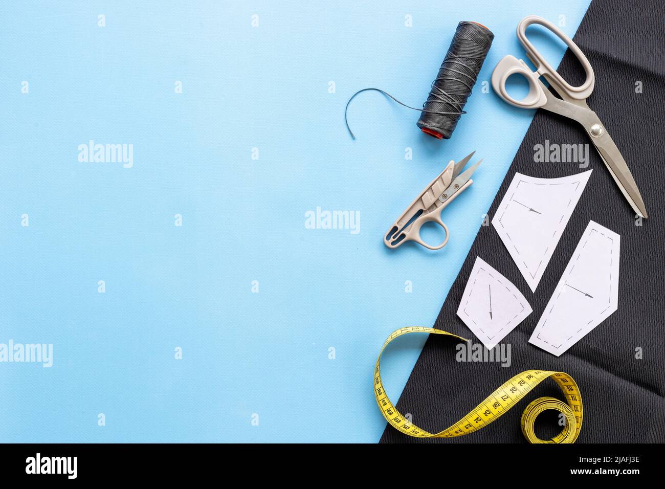 Sewing patterns with fabric - fashion designer table with tailor tools ...