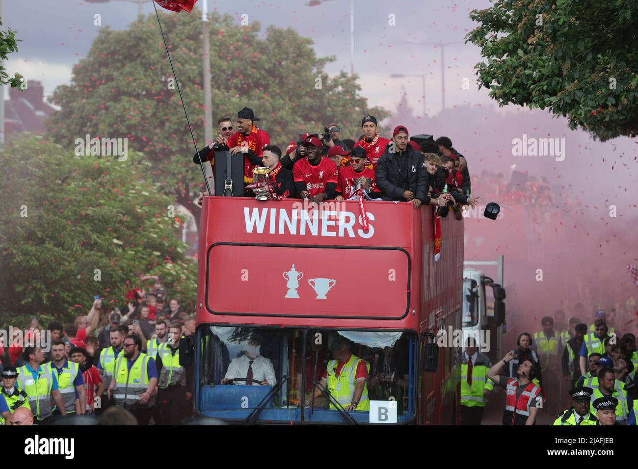 The Liverpool FC squad celebrate during the open top bus parade through ...