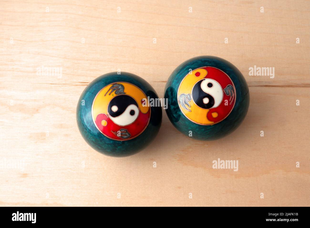 Two baoding balls with yin yang symbol Stock Photo - Alamy