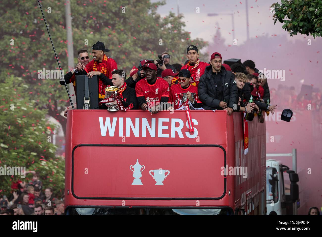 The Liverpool FC squad celebrate during the open top bus parade through ...