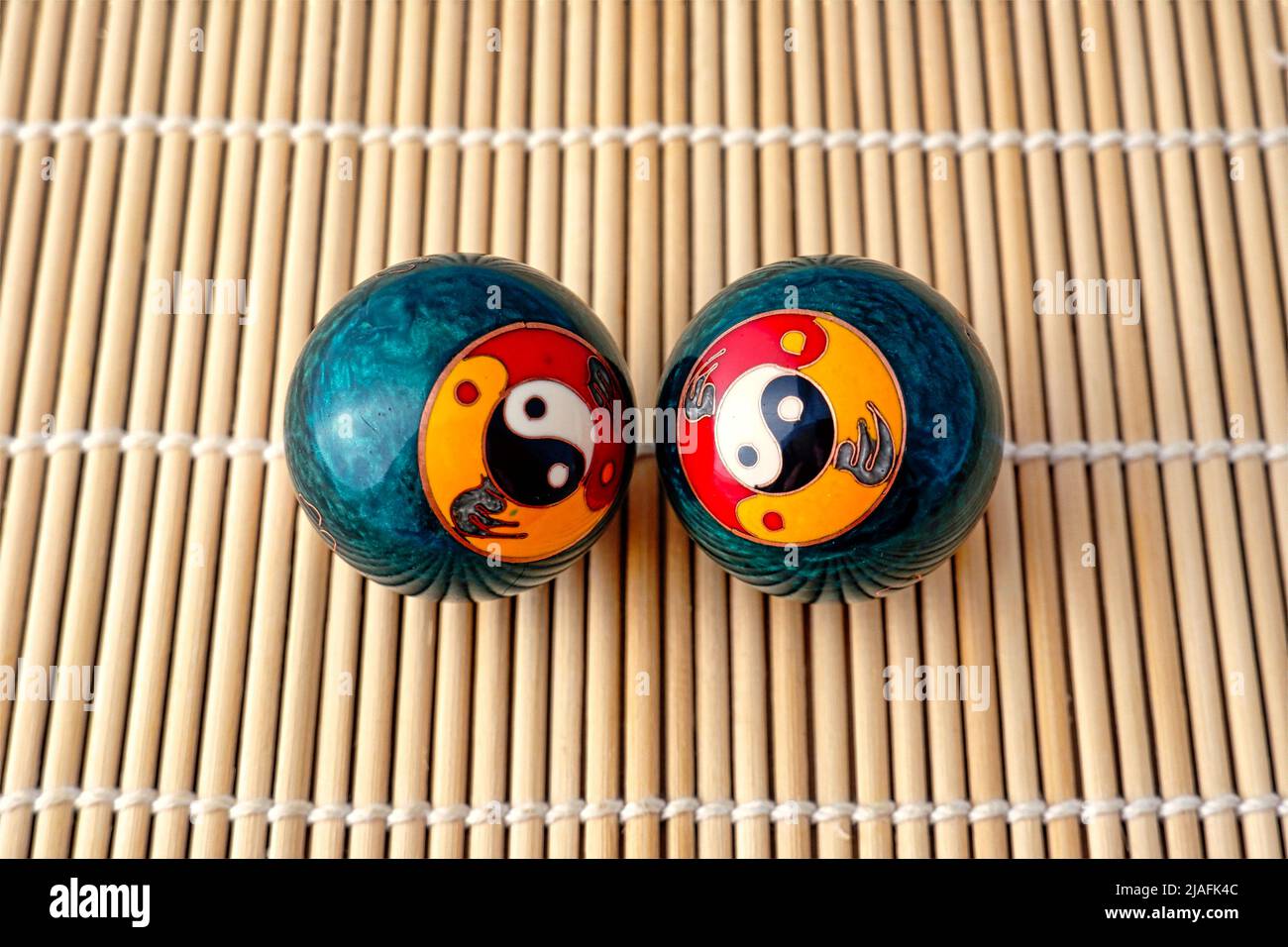 Two baoding balls with yin yang symbol Stock Photo - Alamy
