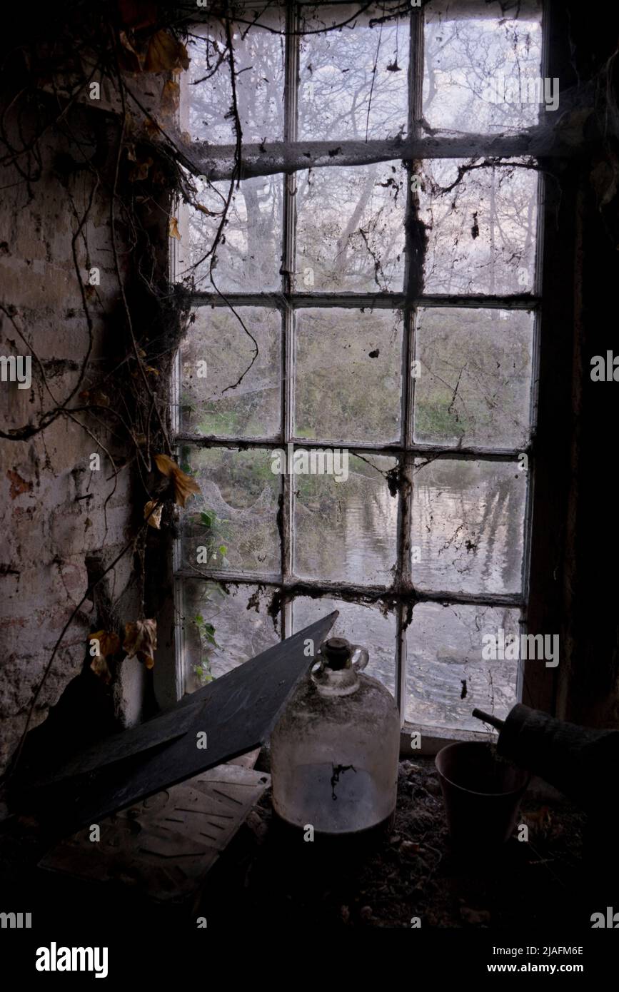 INTERIOR OF STORAGE ROOM WITH OLD FURNITURE AND SIGNS AT A FARM BY ...