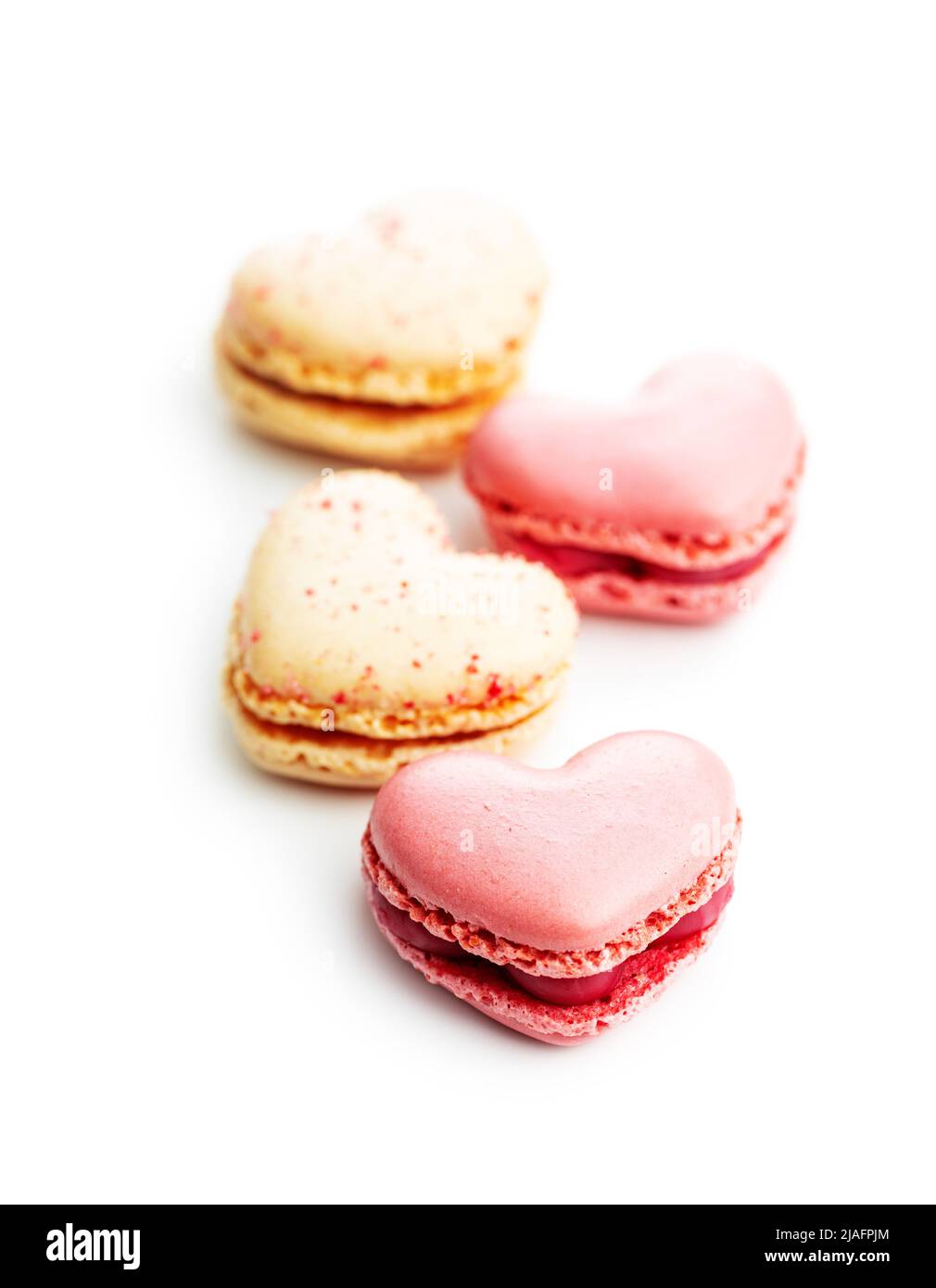 Heart shaped Sweet macarons isolated on a white background Stock Photo ...