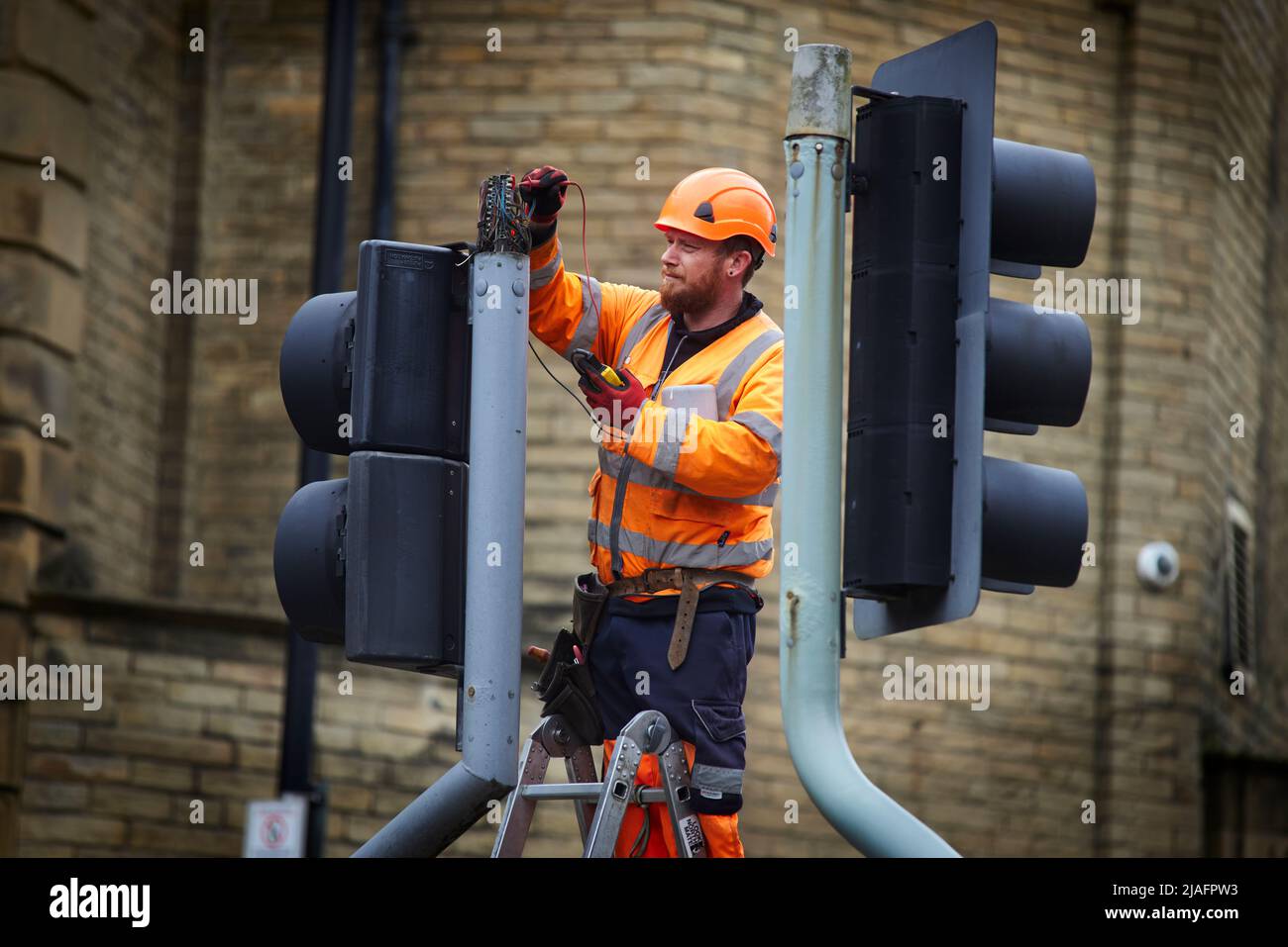 Halifax West Yorkshire, engineer fixing the traffic lights Stock Photo ...