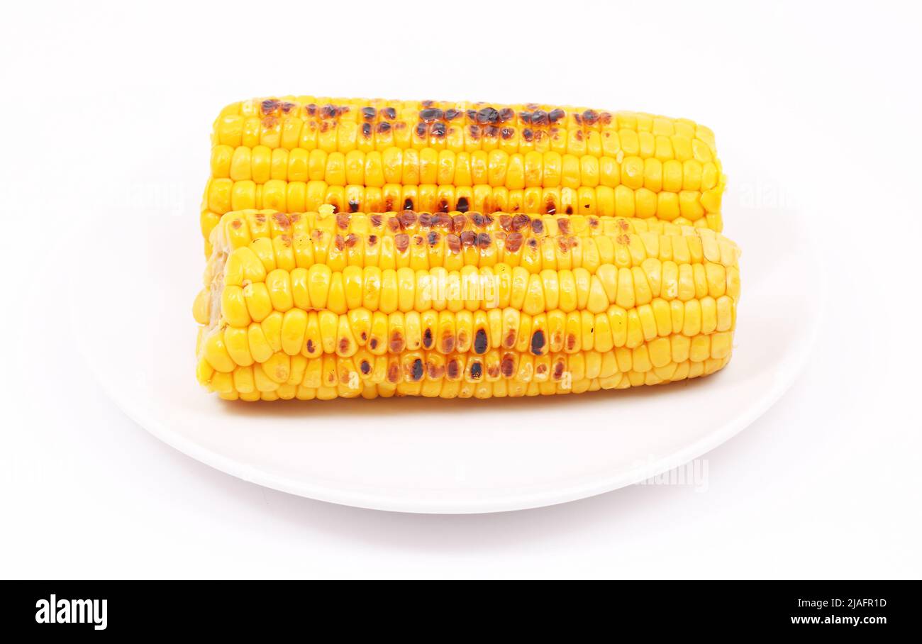 Grilled corn on a white background Stock Photo - Alamy