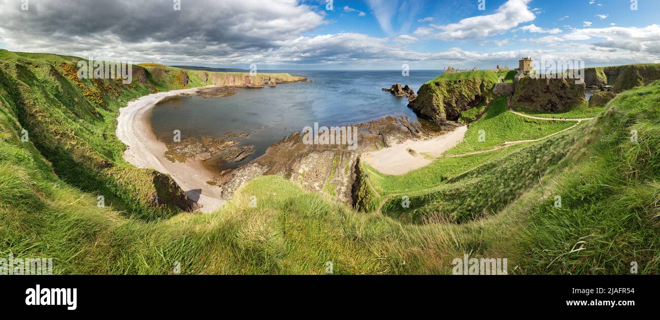 Panorama of a cliff with ancient castle in a bay with blue sky and ...