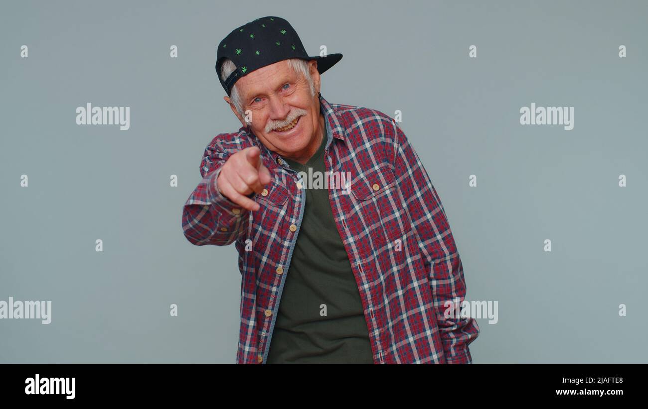 Man pointing finger to camera, laughing out loud, making fun of ...