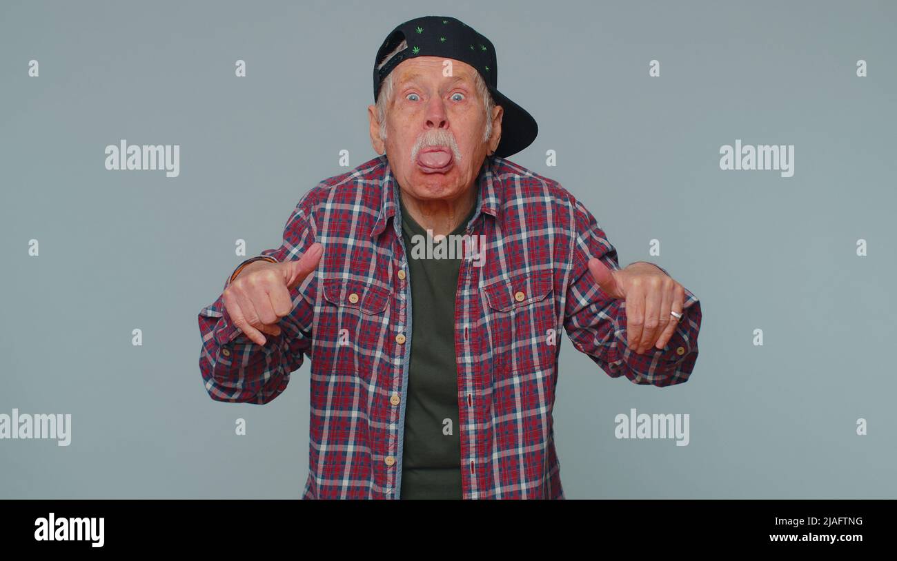 Funny joyful man making playful silly facial expressions, grimacing ...