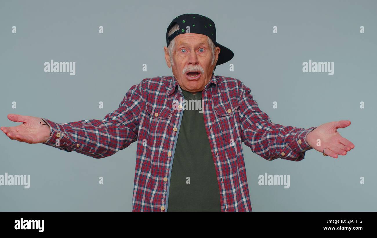 Man raising hands in indignant expression asking why what reason of ...