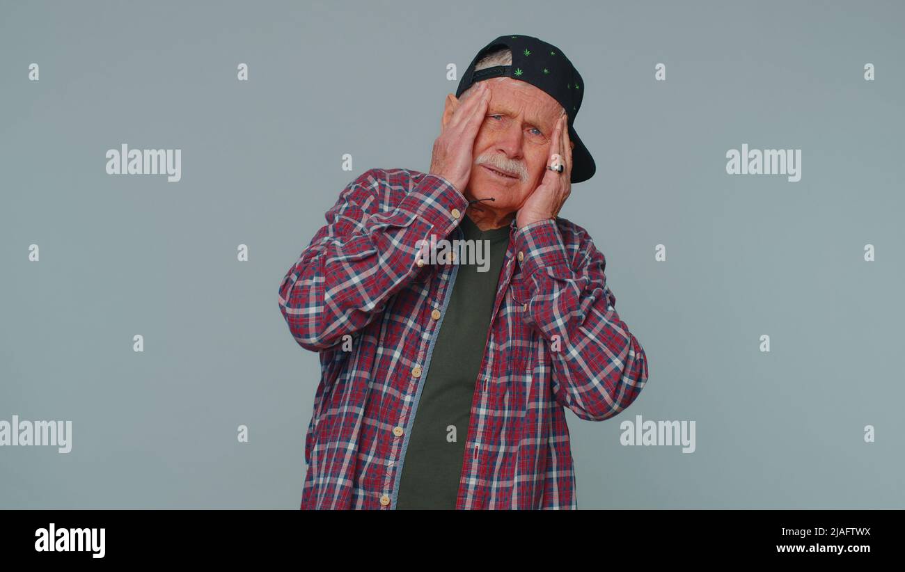Senior man rubbing temples to cure headache problem, suffering from ...