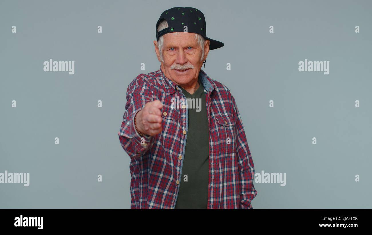 Friendly man outstretching hand to camera, offering handshake, greeting ...