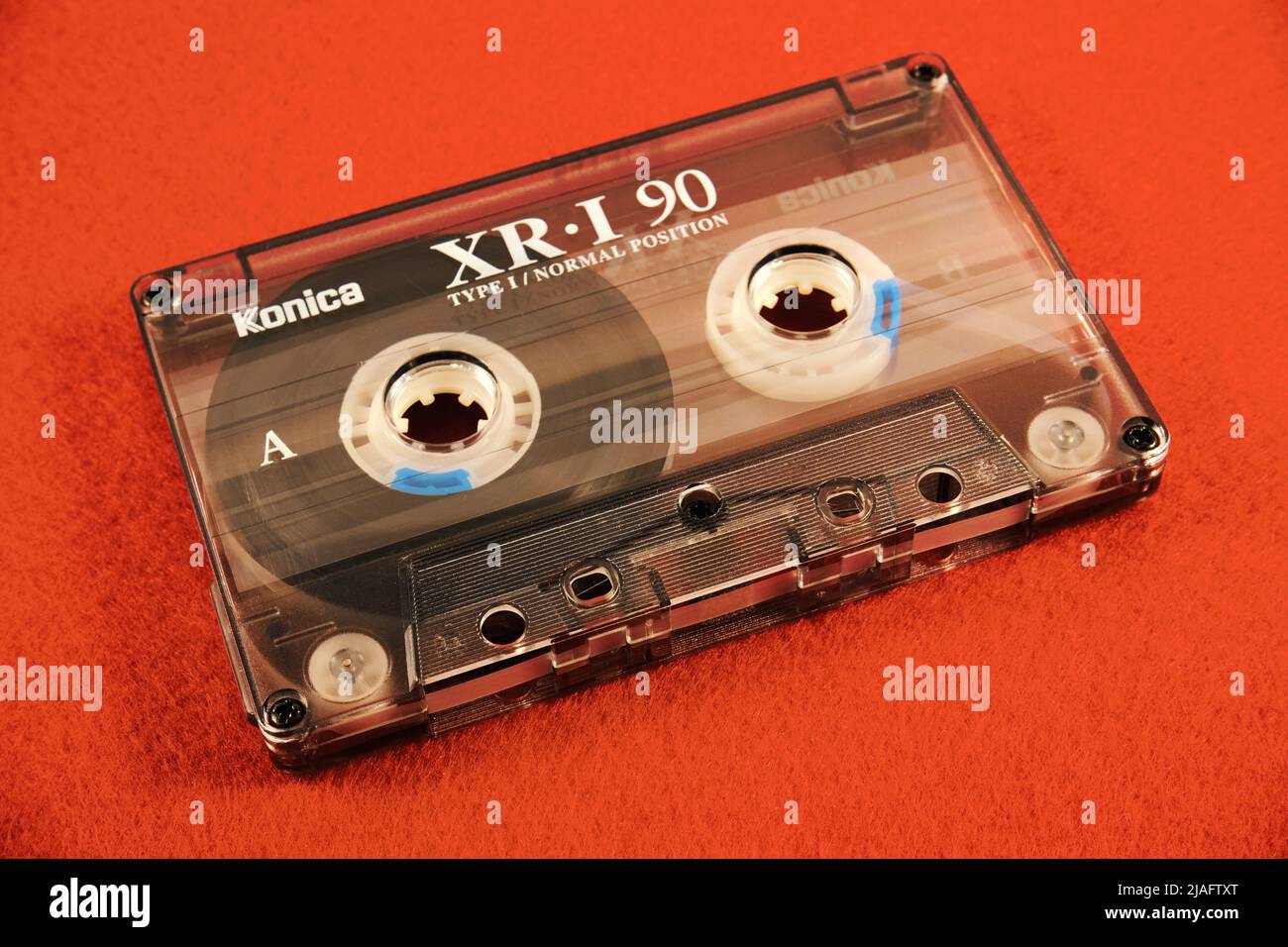 Audio cassette on a red background. Analog audio tape recording Stock ...