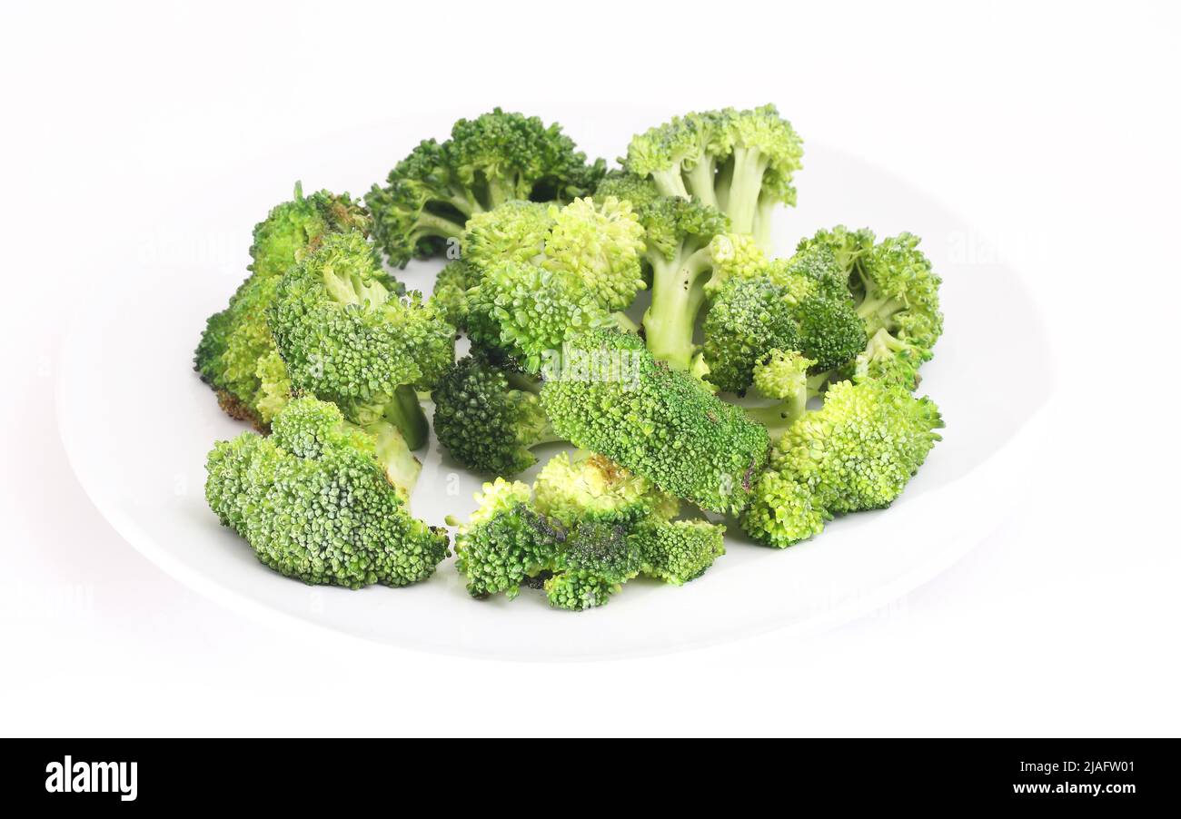 Grilled broccoli on white background Stock Photo - Alamy
