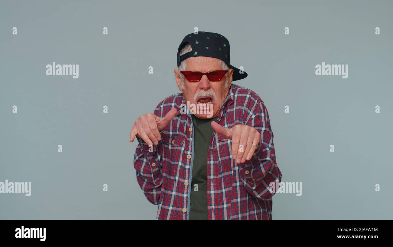 Funny joyful man making playful silly facial expressions, grimacing ...