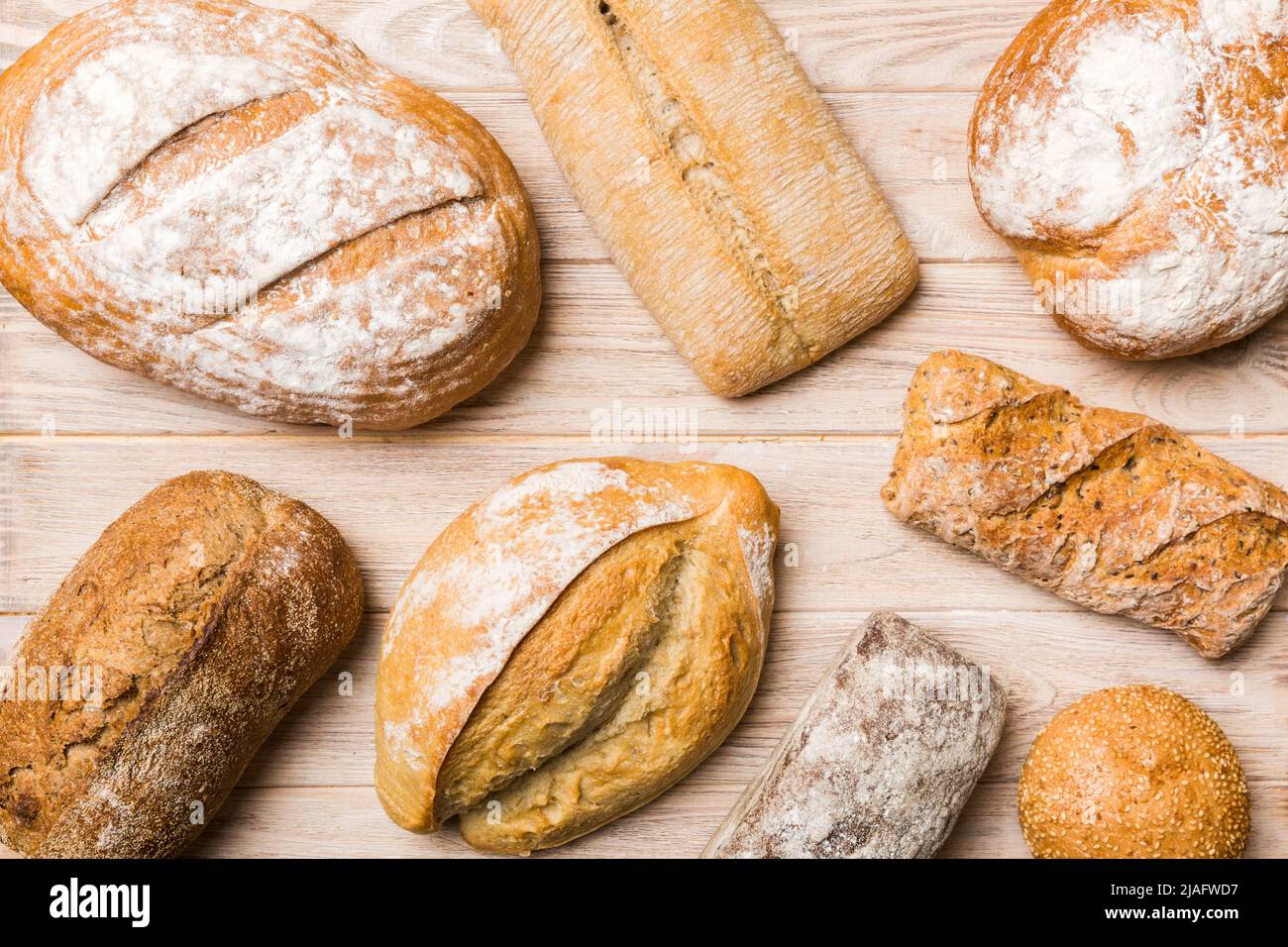 Homemade natural breads. Different kinds of fresh bread as background ...