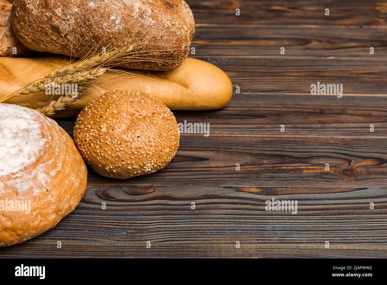Homemade natural breads. Different kinds of fresh bread as background ...