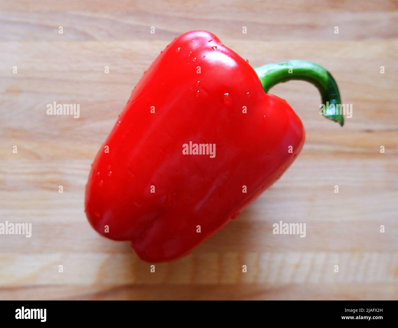 fresh red bell pepper side view Stock Photo - Alamy