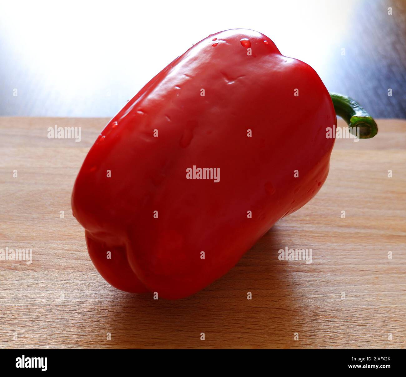 fresh red bell pepper side view Stock Photo - Alamy